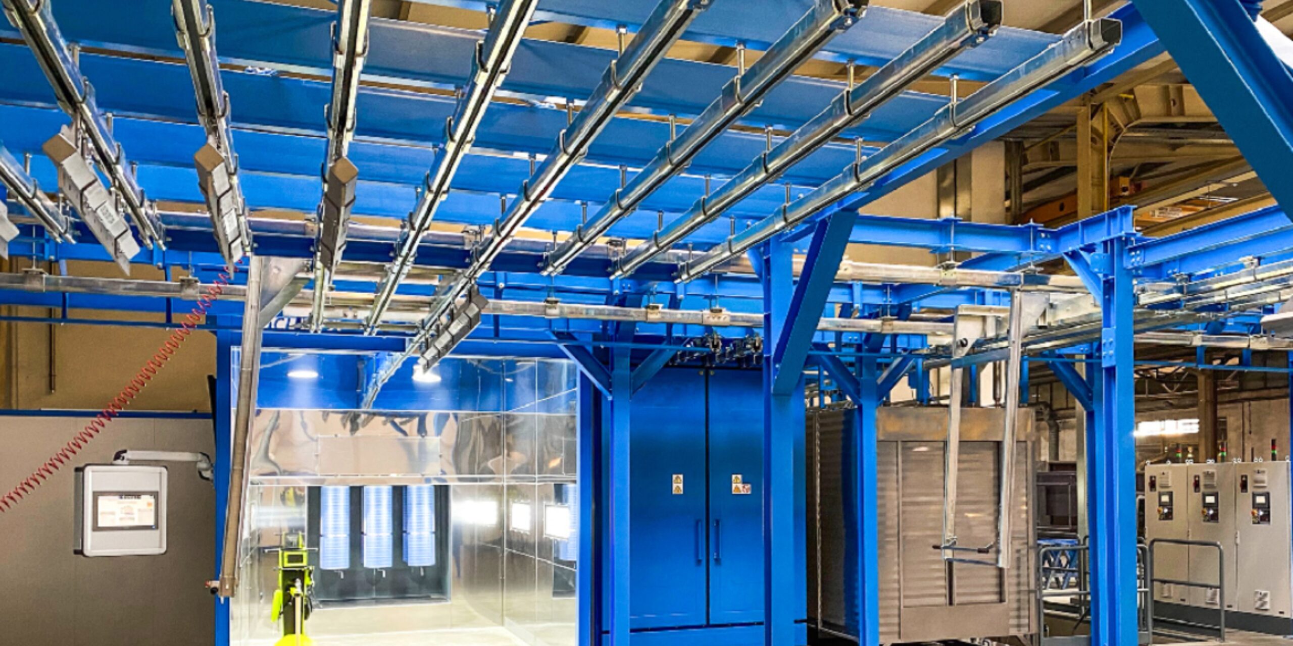 Streamline with Overhead Conveyors - NIKO Conveyors